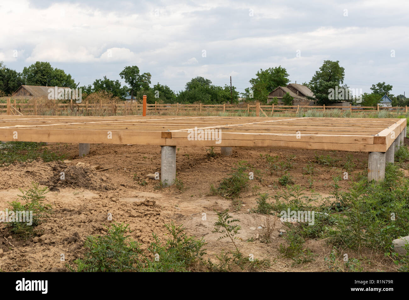 On pile foundations support the floor of a frame house Stock Photo - Alamy