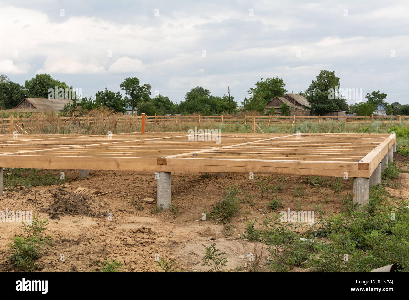 On pile foundations support the floor of a frame house Stock Photo - Alamy