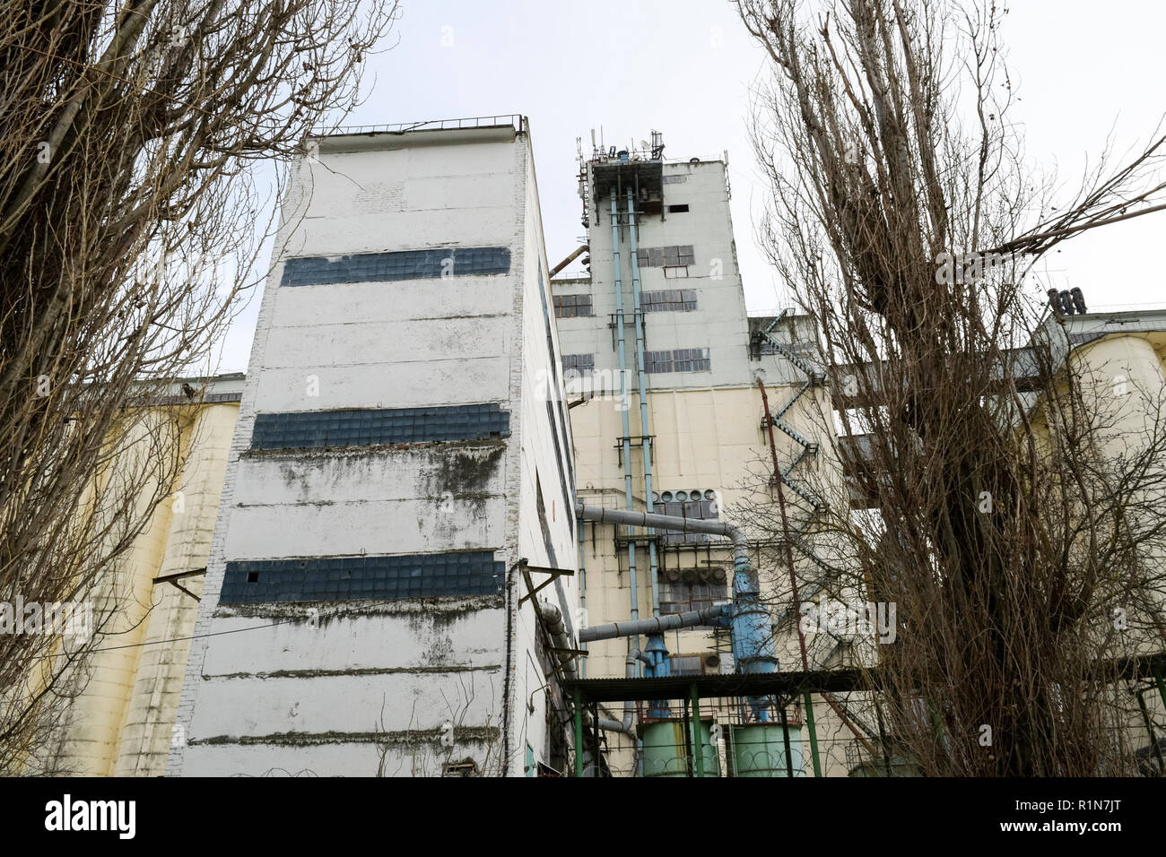 Building for storing and drying grain. Soviet-built elevator Stock ...