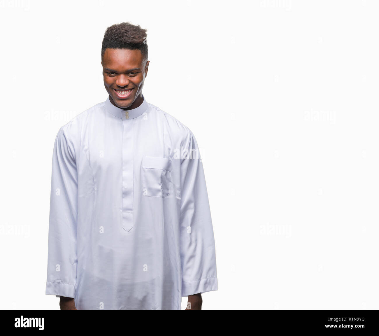 Young arabic african man wearing traditional djellaba over isolated ...