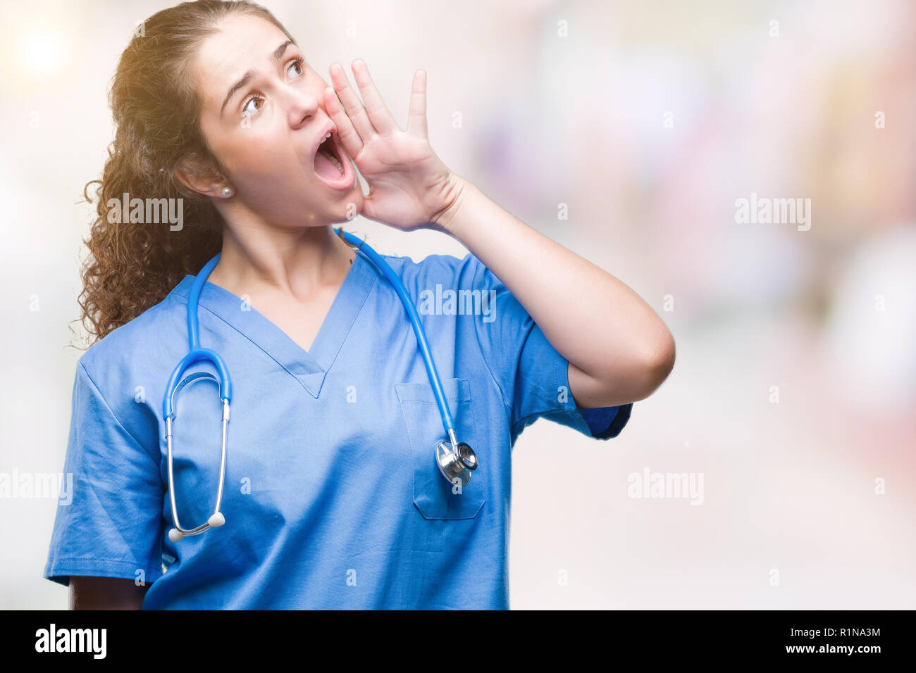 Young brunette doctor girl wearing nurse or surgeon uniform over ...