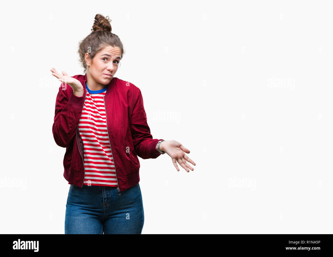Beautiful brunette curly hair young girl wearing a jacket over isolated ...