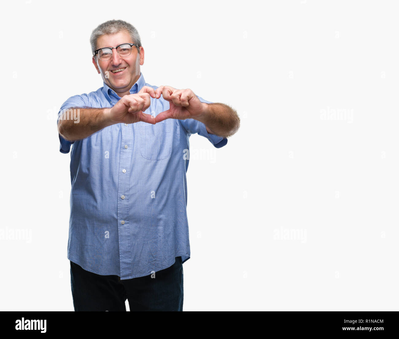 Smiling old couple making heart Cut Out Stock Images & Pictures - Alamy