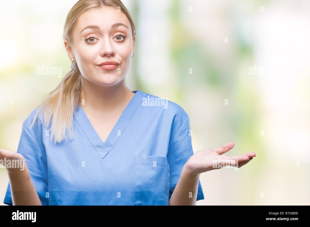 Young blonde surgeon doctor woman wearing medical uniform over isolated ...