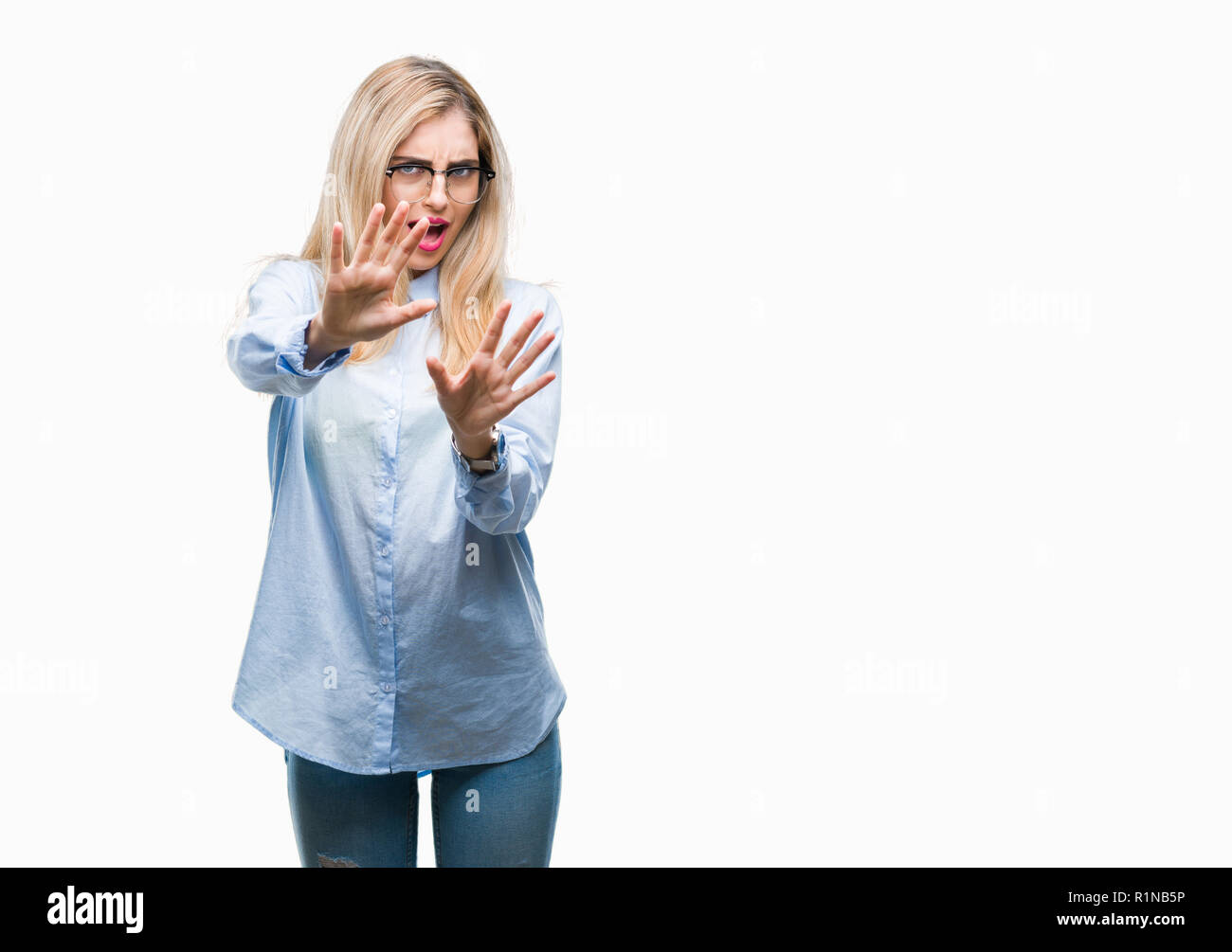 Young beautiful blonde business woman wearing glasses over isolated ...