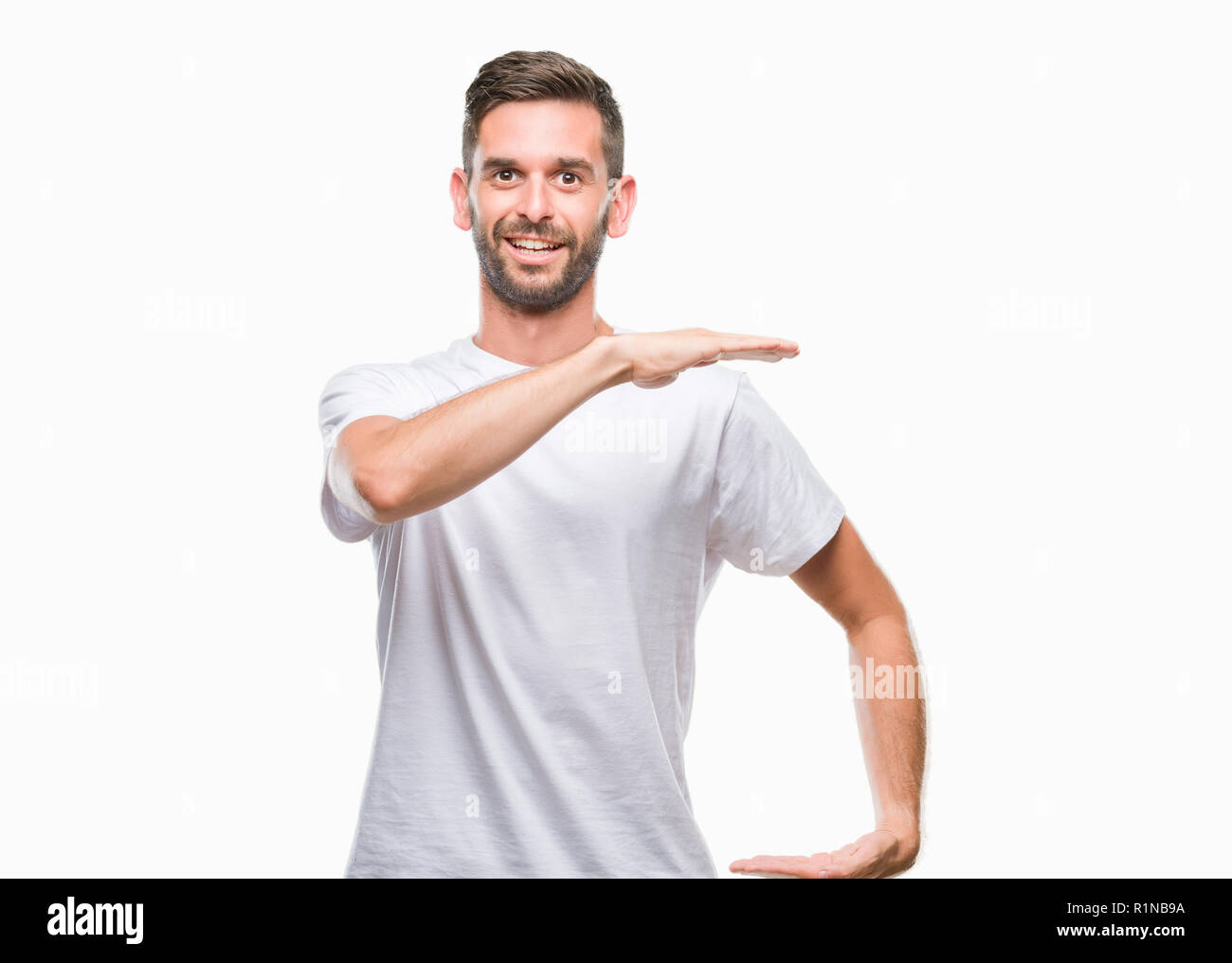 Young handsome man over isolated background gesturing with hands ...