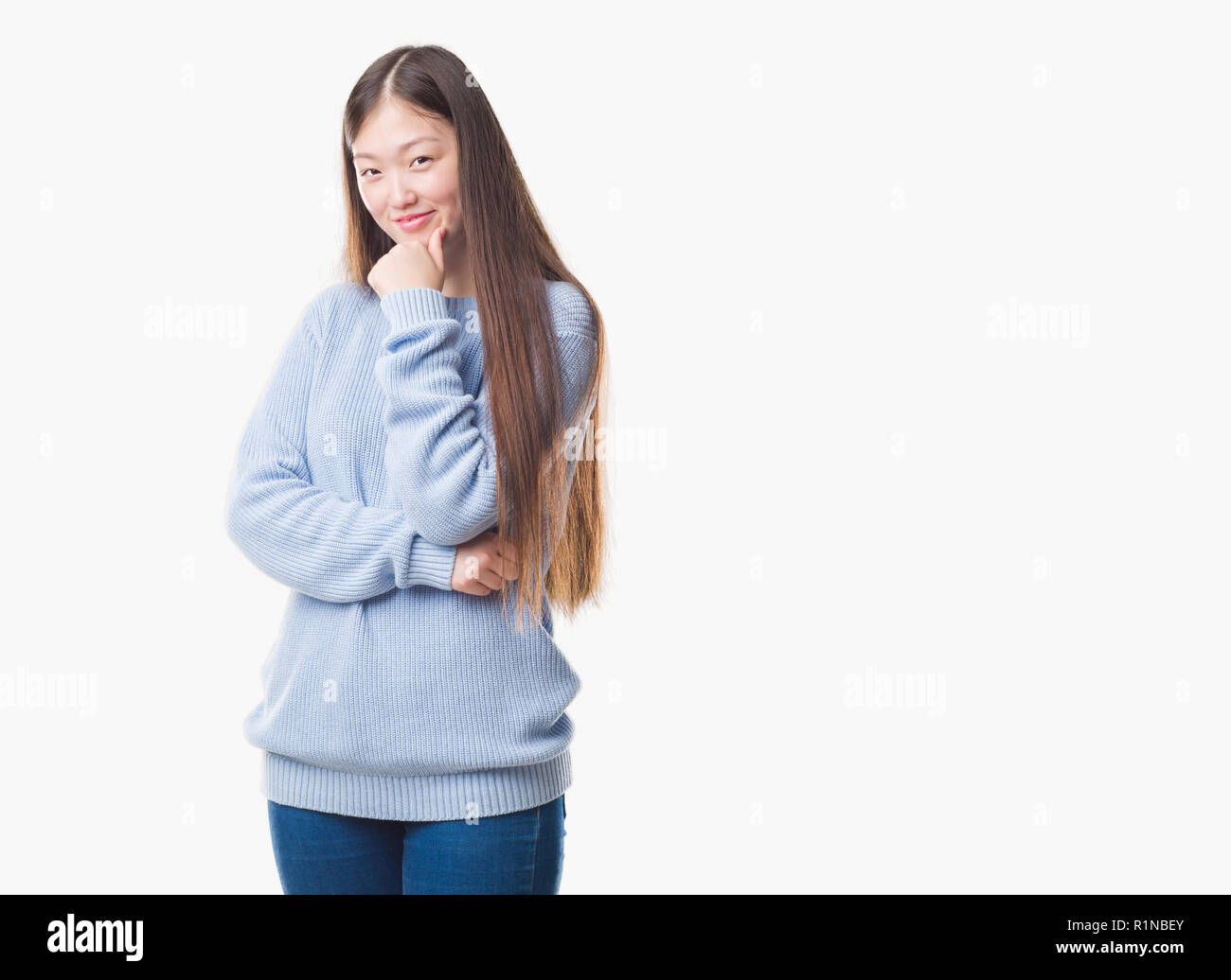 Young Chinese woman over isolated background looking confident at the ...