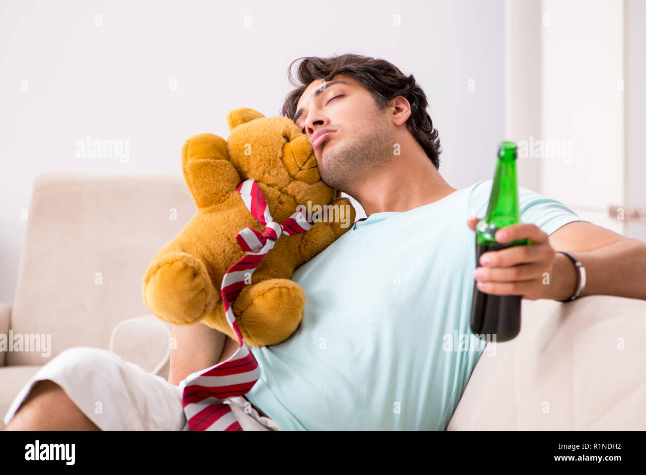 Young drunk handsome man after party at home Stock Photo - Alamy