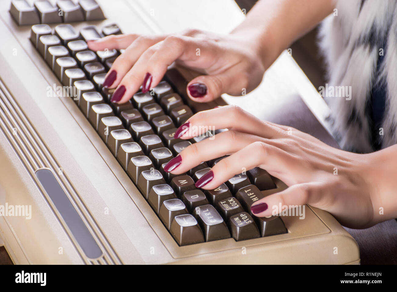 Woman hands typing on old computer keyboard on desk in office. Retro ...