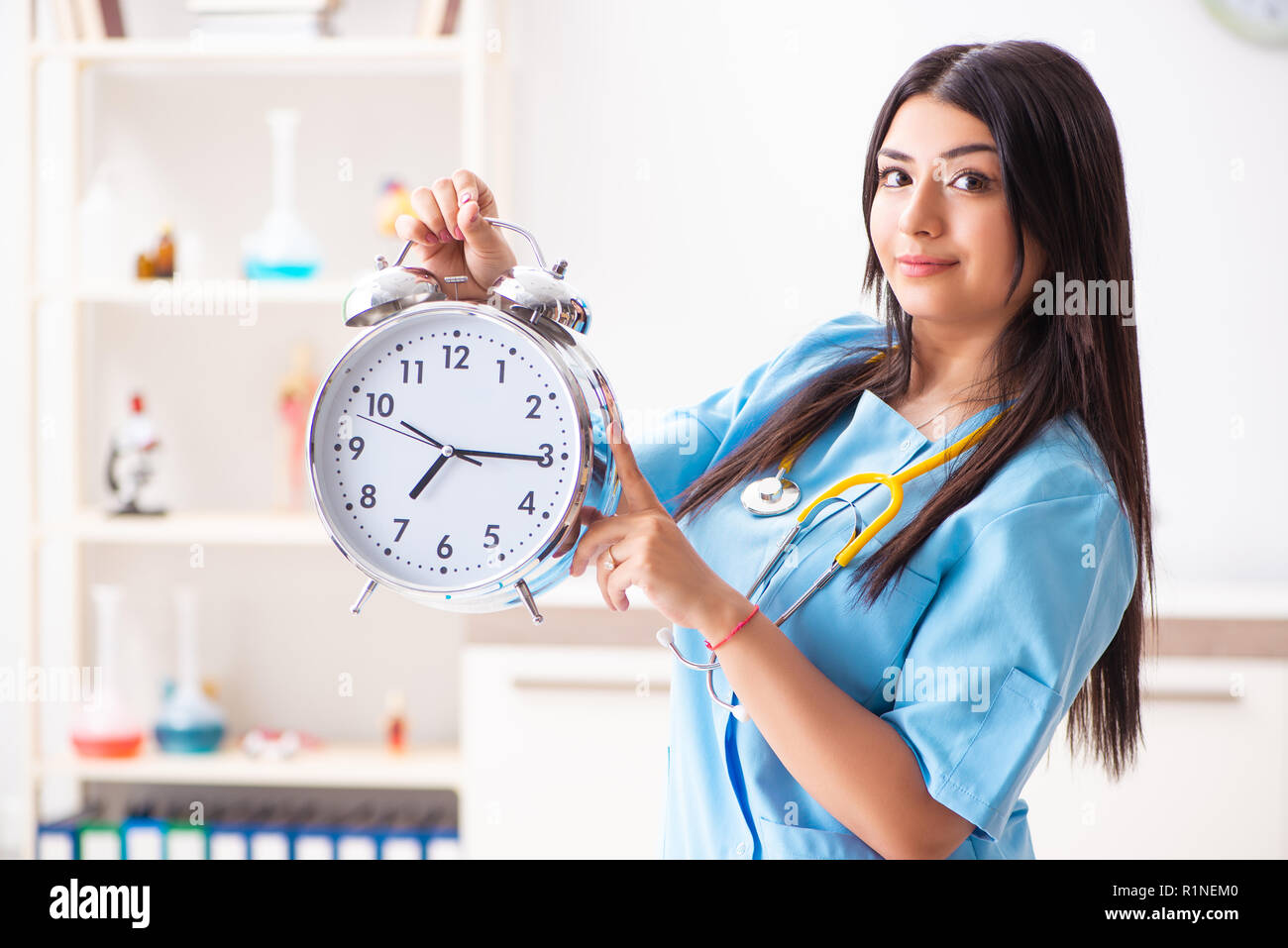 Young beautiful female doctor working in the clinic Stock Photo - Alamy