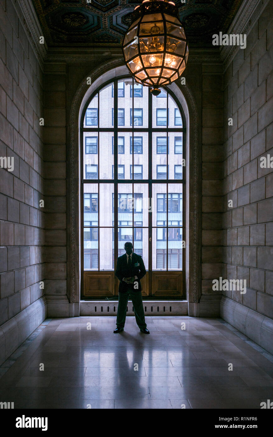 Man standing in front of window, New York City, New York State, USA ...