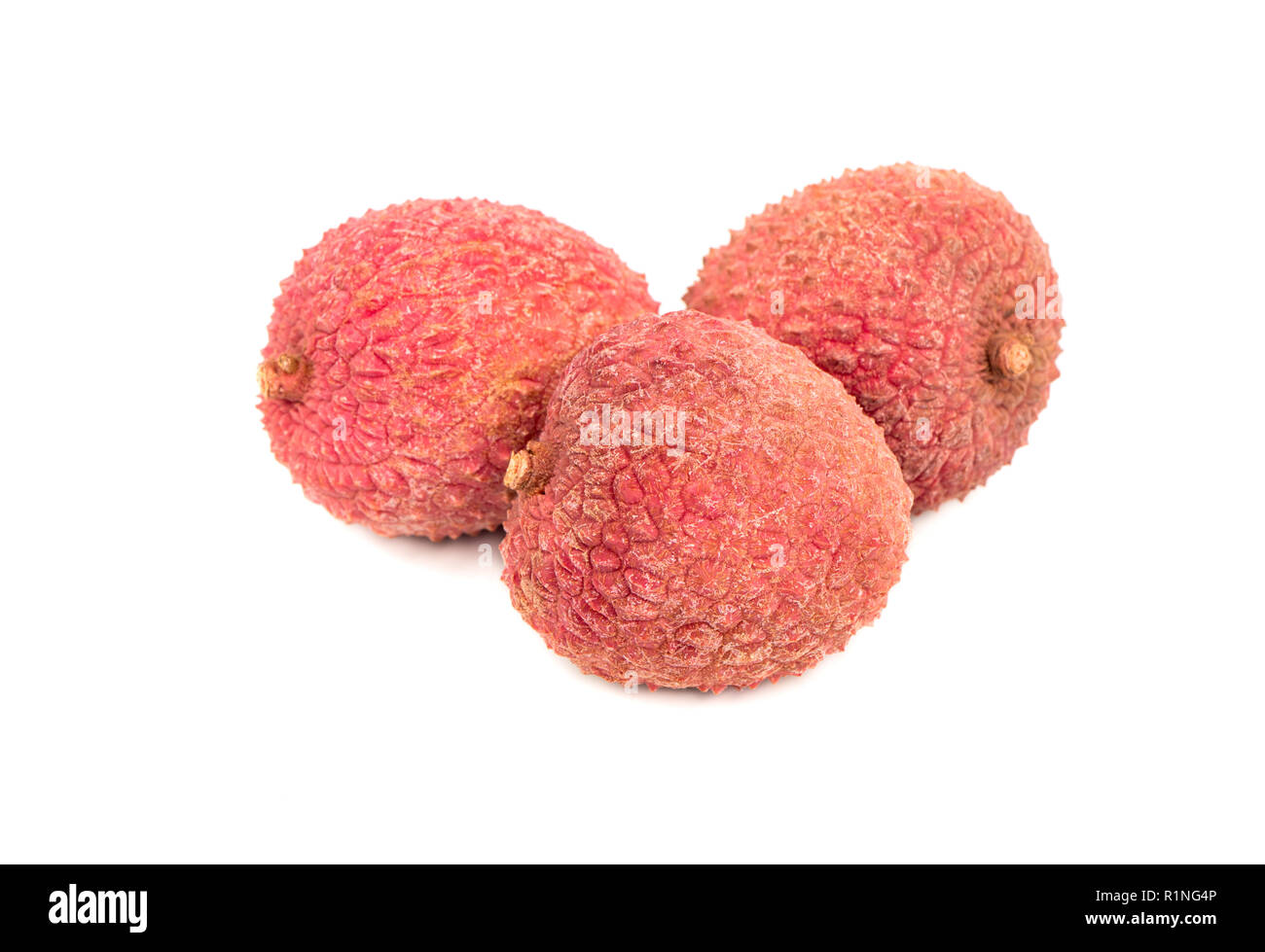Three delicious lychee fruit in shell on white background Stock Photo ...