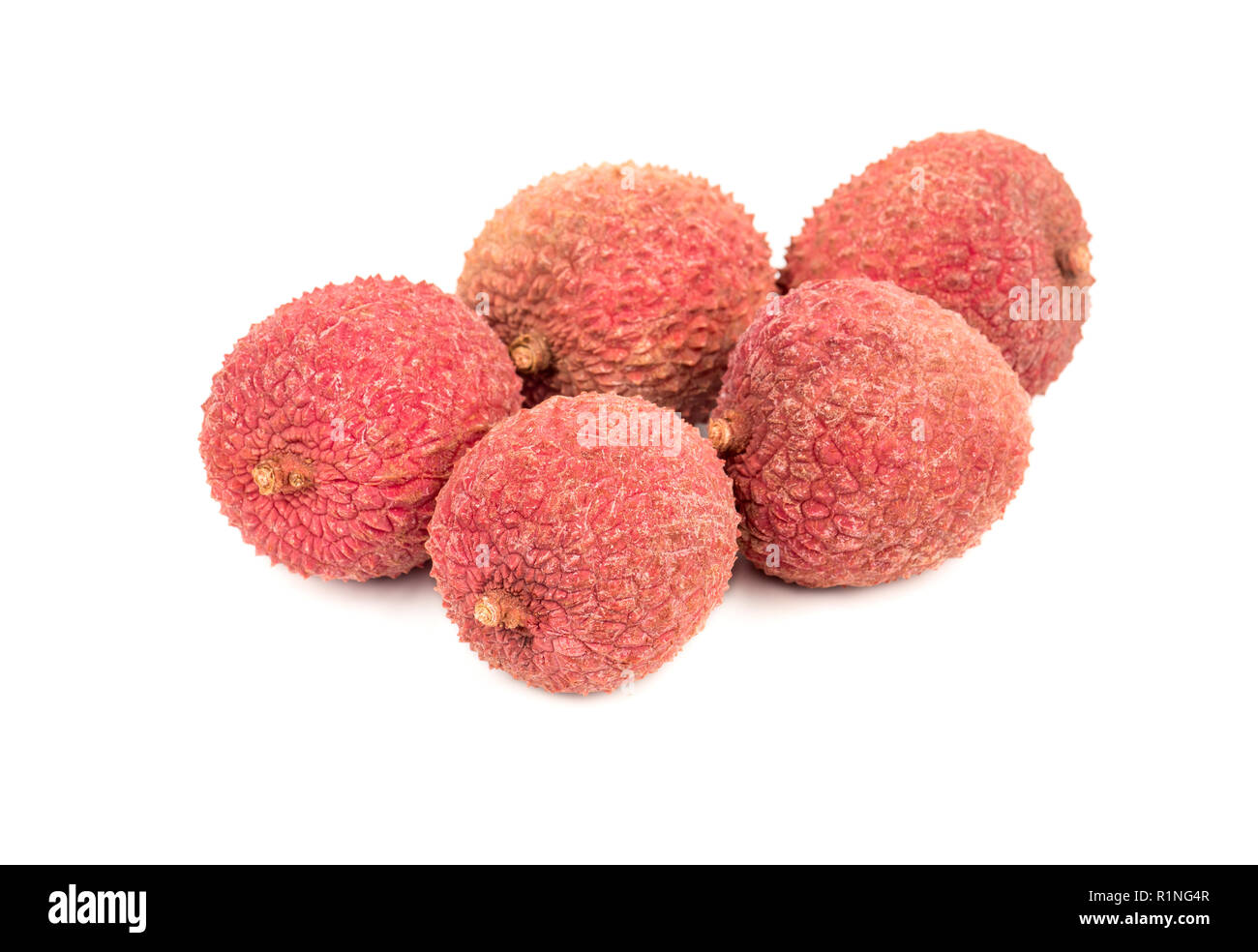 Several fruits of litchi in shell on white background Stock Photo - Alamy