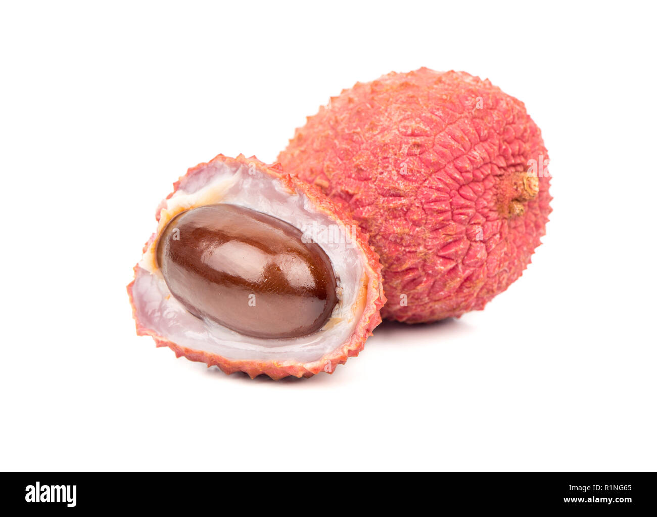 Lychee fruit in the shell with a juicy half on white background Stock ...