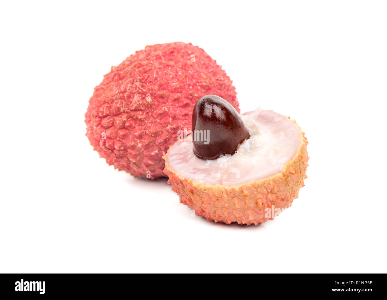 Chinese lychee fruit in-shell half on white background Stock Photo - Alamy