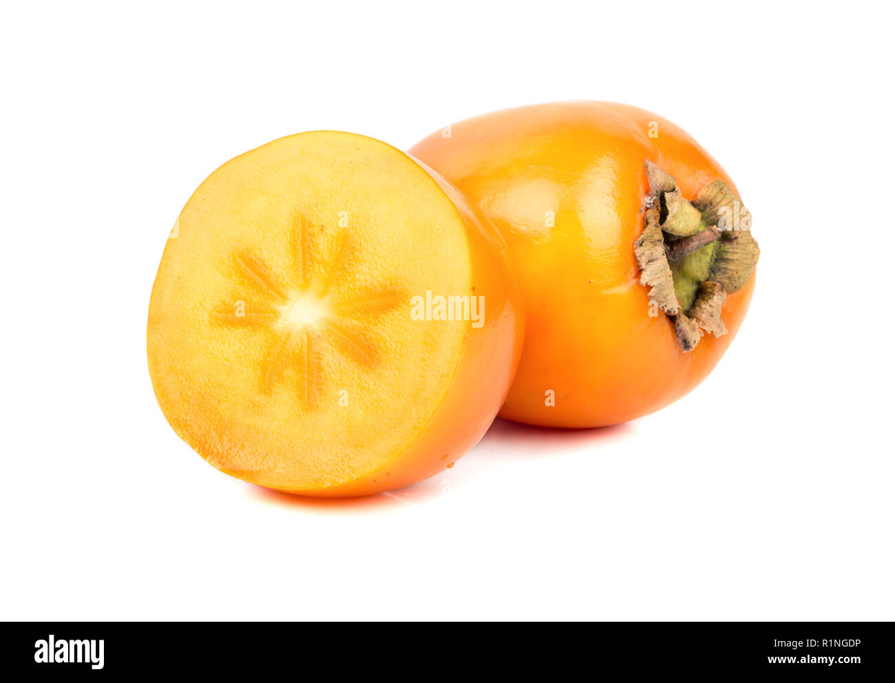 Fresh fruit persimmons with half on white background Stock Photo - Alamy