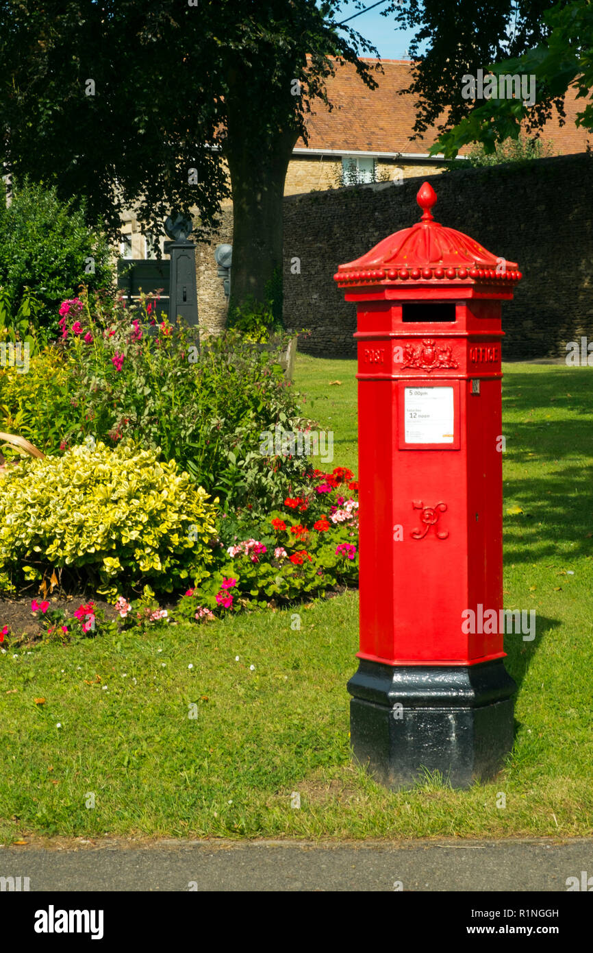A traditional old red Victorian royal mail post box still in use in the ...