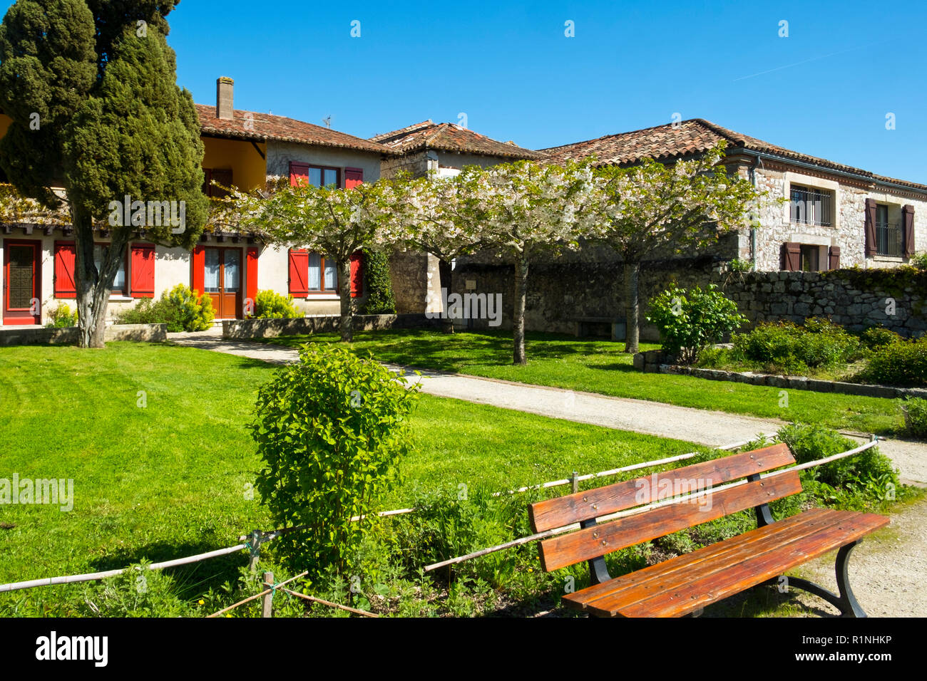 Spring colour around the church of Sainte Foy, Pujols, Lot-et-Garonne ...