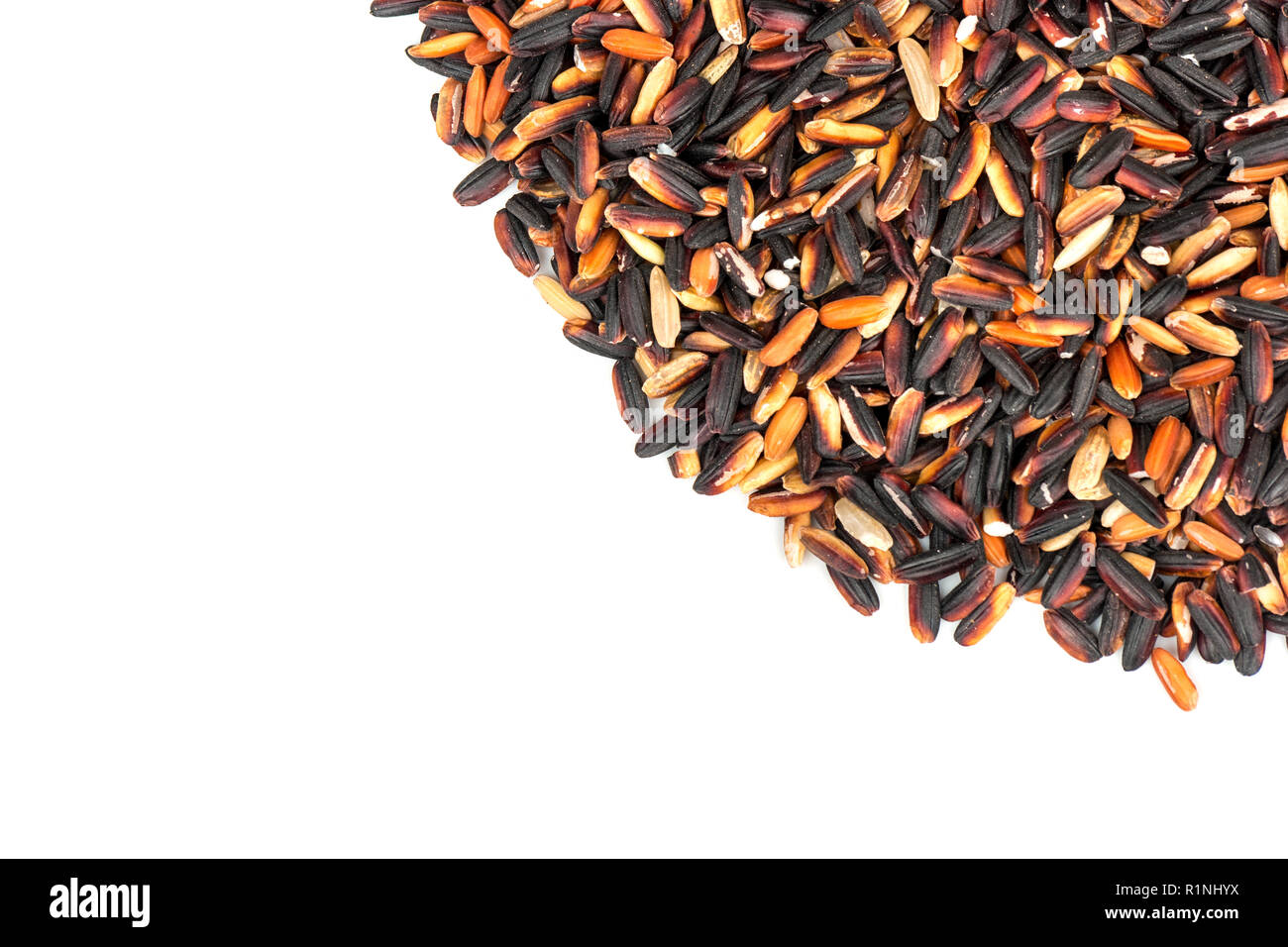 Scattered raw wild rice on white background Stock Photo - Alamy