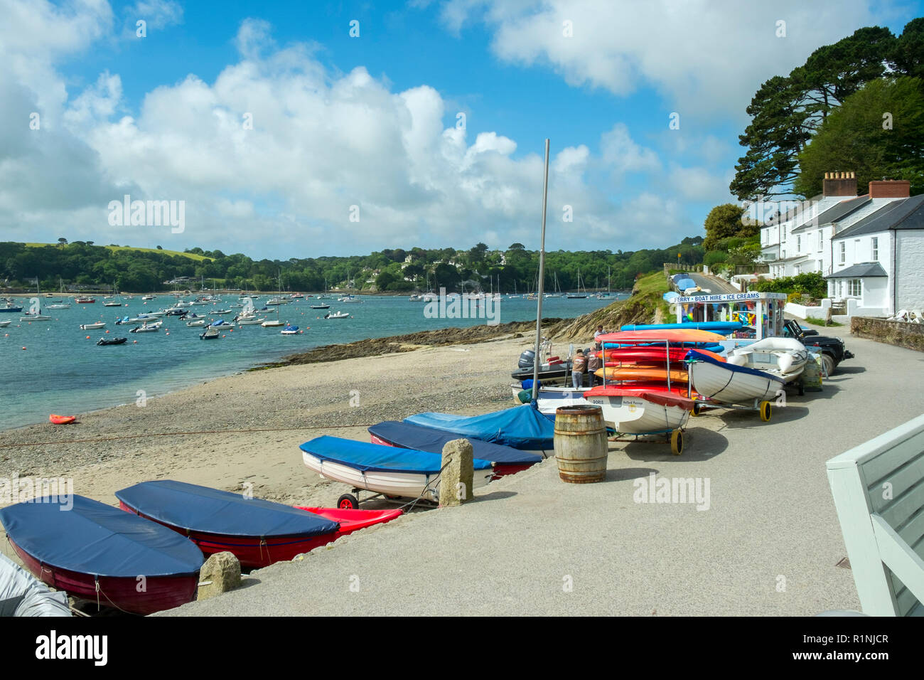 Helford Passage, UK - 8th June 2017: Colourful small boats lined up at ...