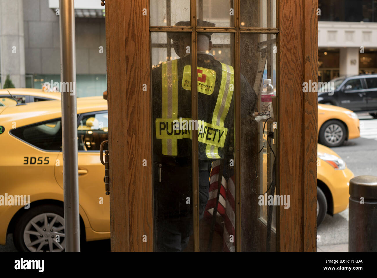 Security officer standing in a booth, New York City, New York State ...