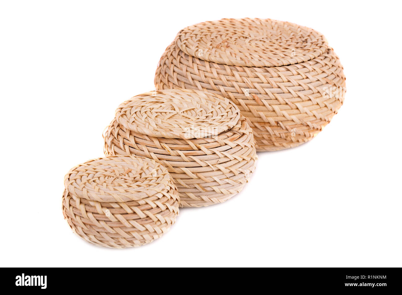 Three wicker boxes isolated on white background Stock Photo - Alamy