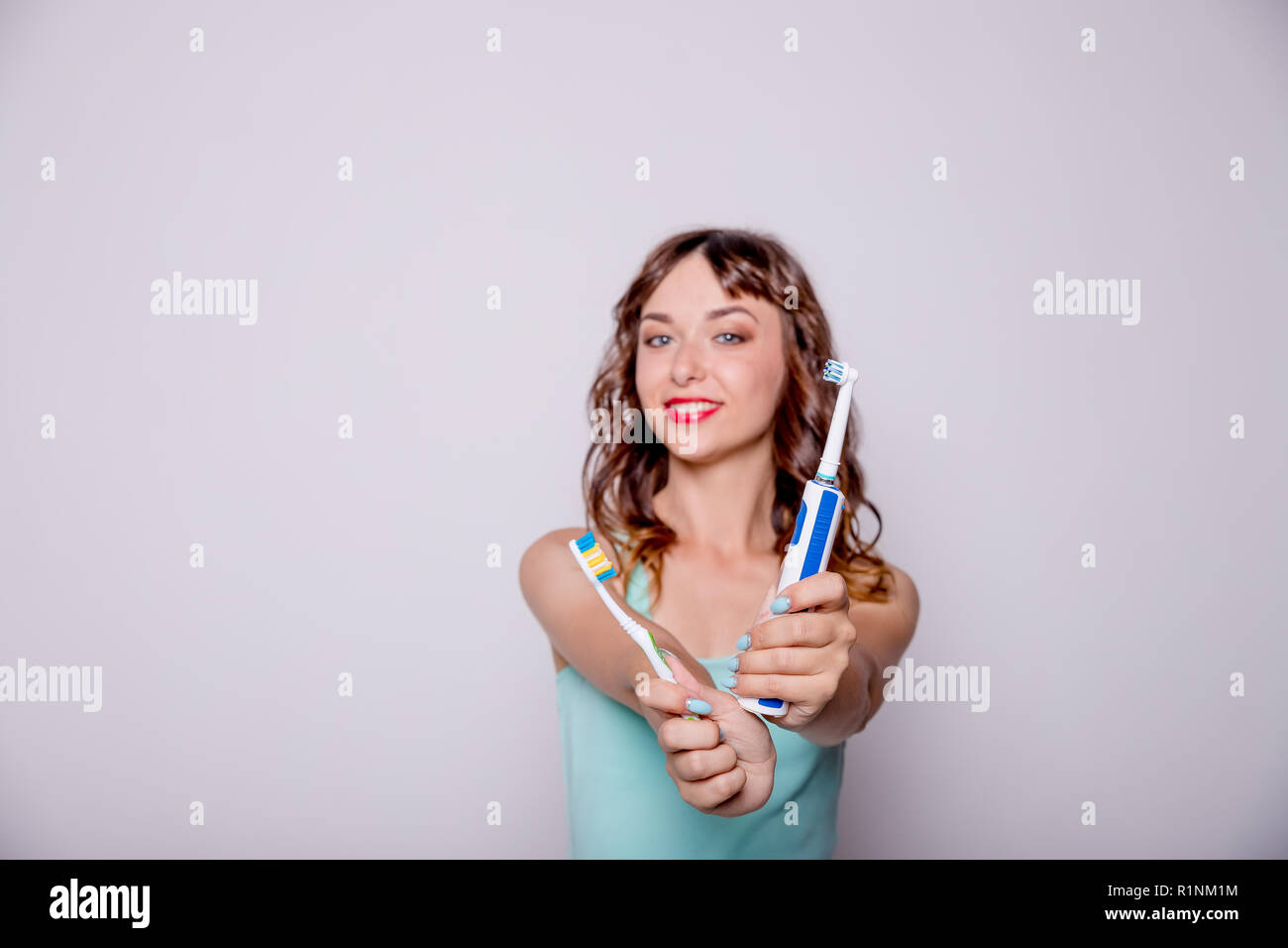 electric and traditional toothbrush.Hygiene of the oral cavity. A young ...