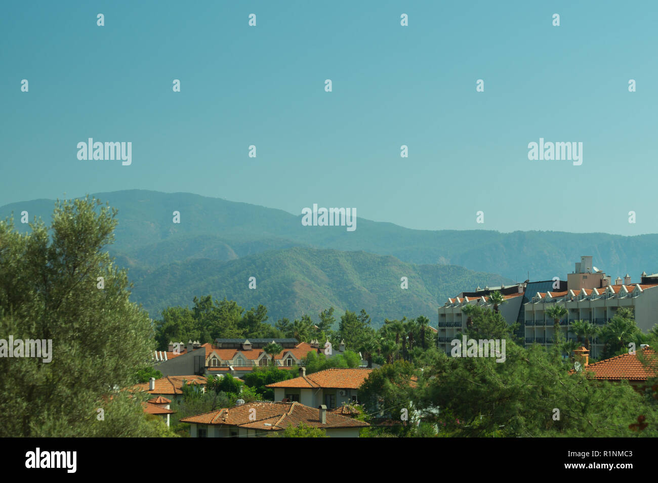 Mountain town panoramic view. landscape with a city between the hills ...