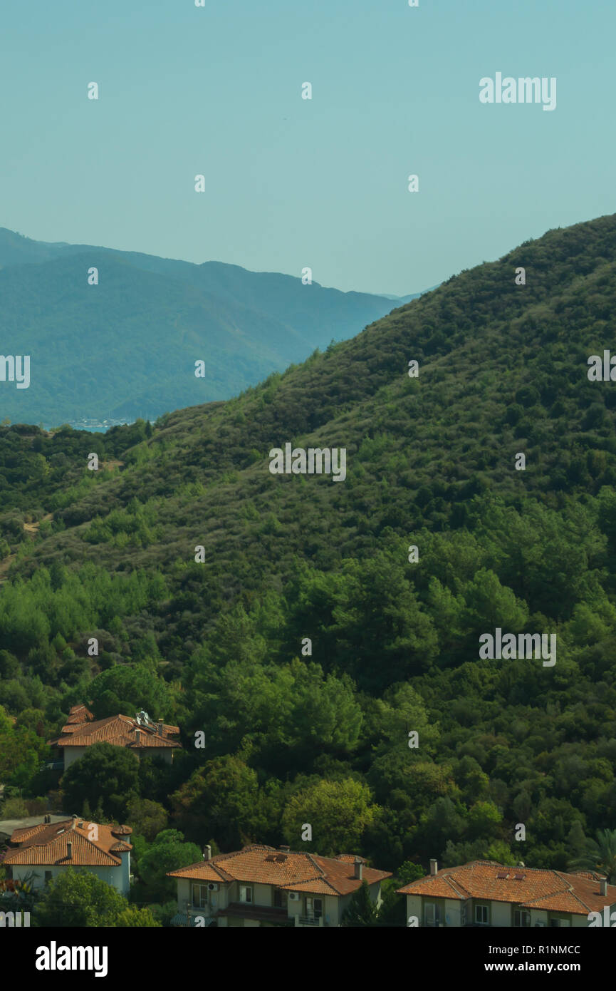Mountain town panoramic view. landscape with a city between the hills ...