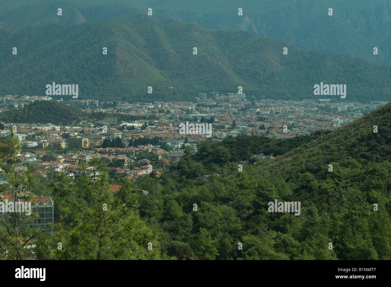 Mountain town panoramic view. landscape with a city between the hills ...