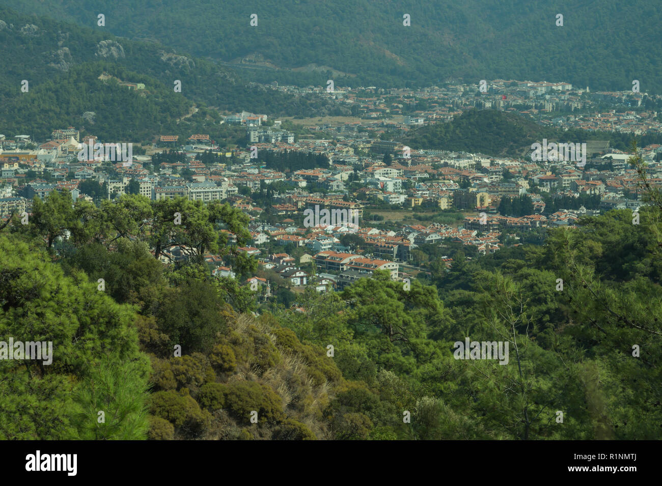 Mountain town panoramic view. landscape with a city between the hills ...