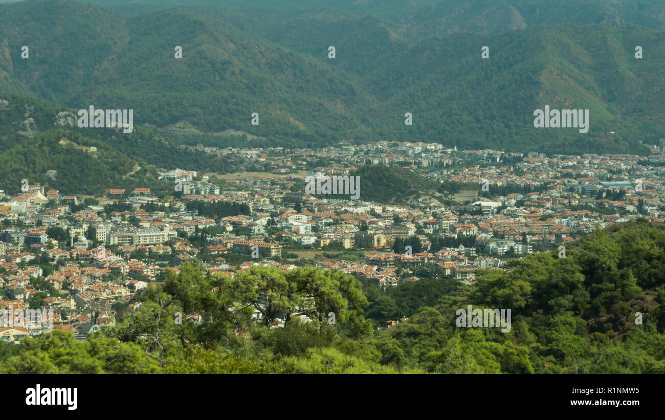 Mountain town panoramic view. landscape with a city between the hills ...