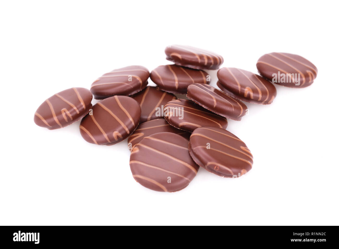 Heap of chocolate cookies isolated on white background Stock Photo - Alamy