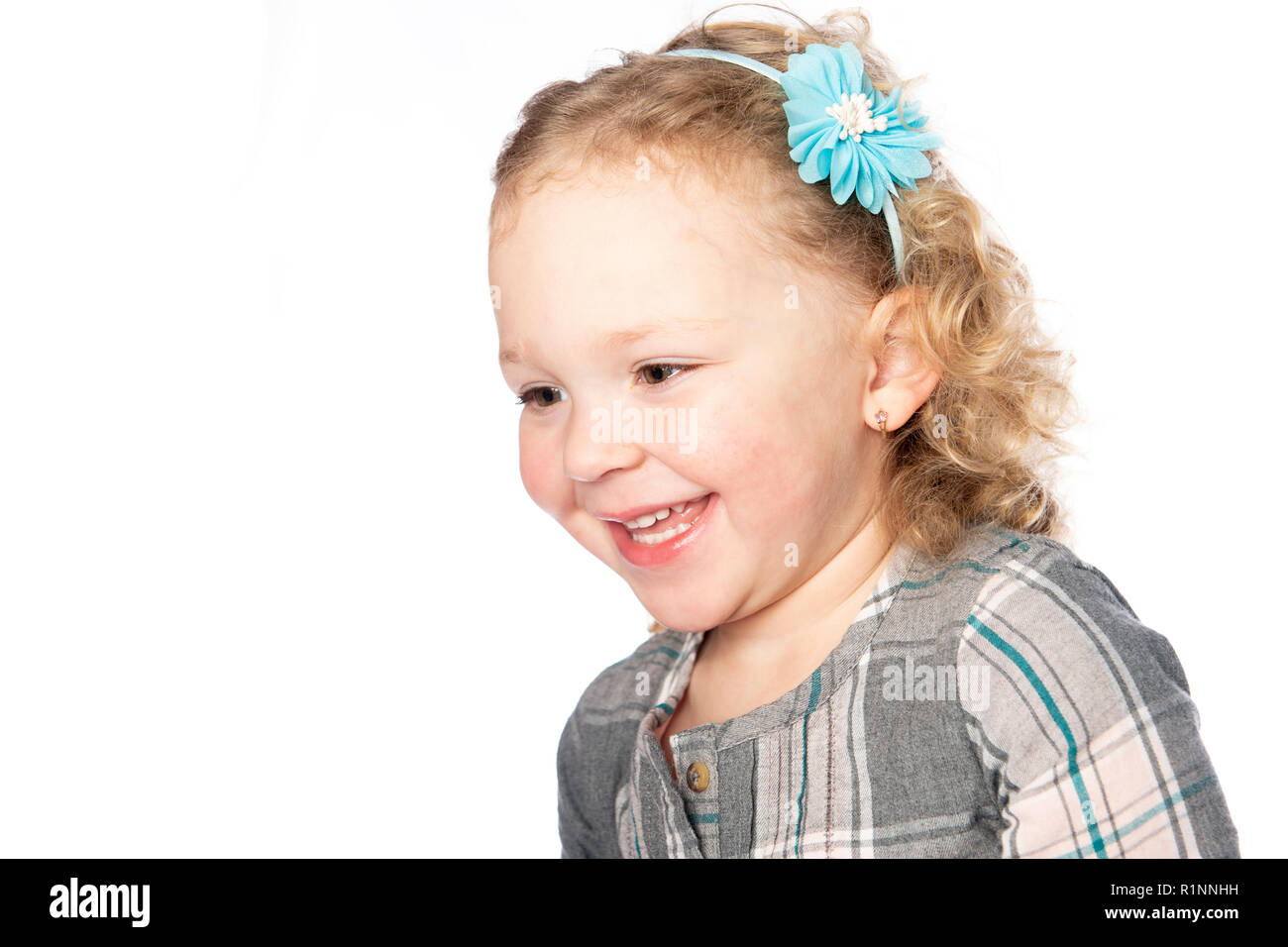 A little girl 3 years old isolated on white background Stock Photo - Alamy