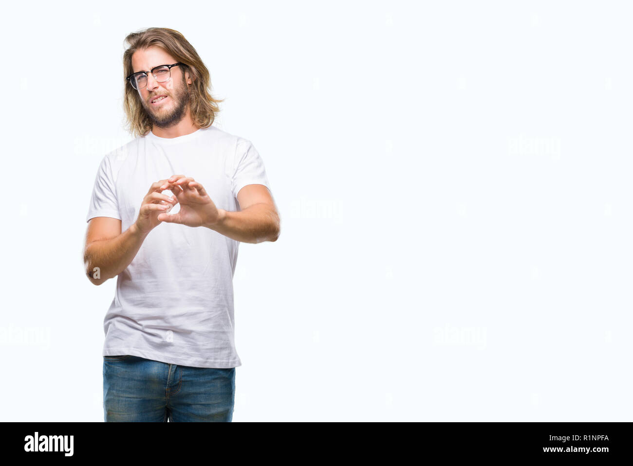 Young handsome man with long hair wearing glasses over isolated ...