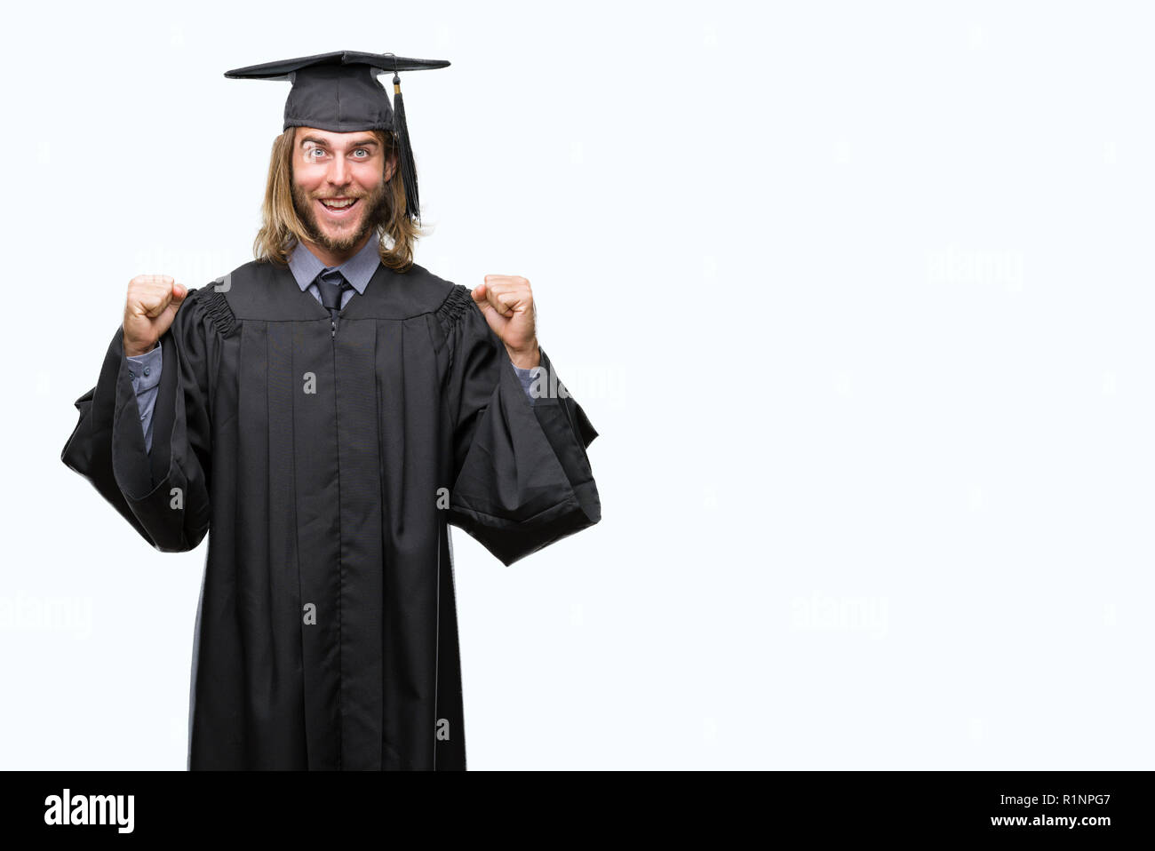 Young handsome graduated man with long hair over isolated background ...