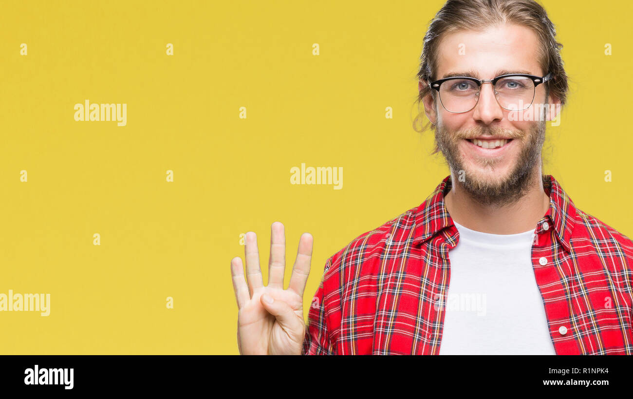 Young handsome man with long hair wearing glasses over isolated ...