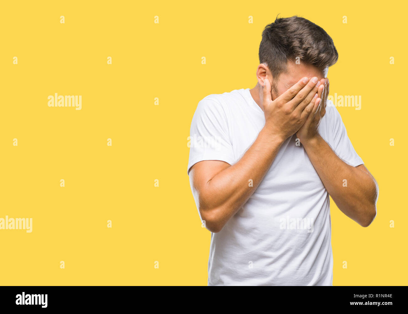 Young handsome man over isolated background with sad expression ...