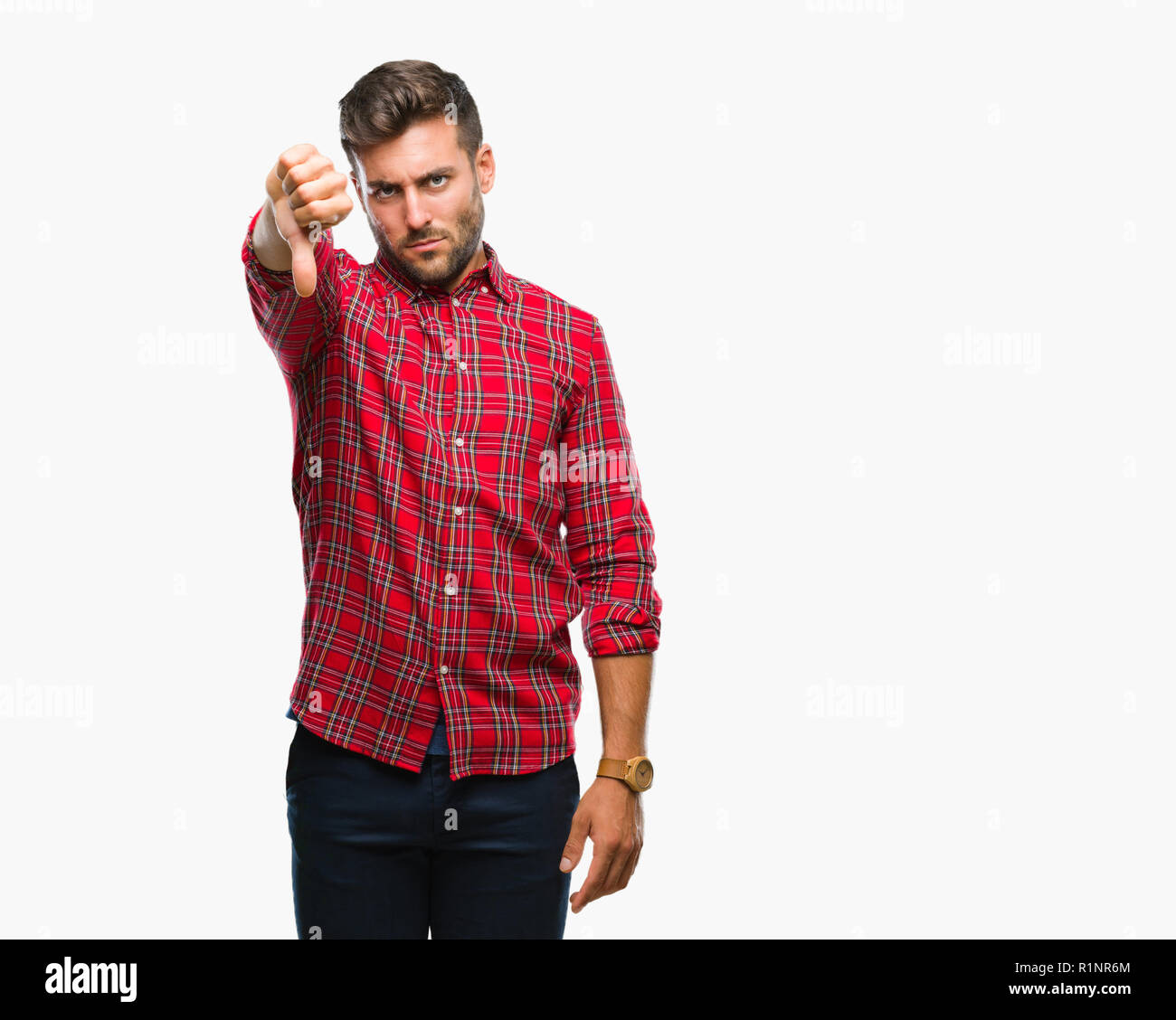Young handsome man over isolated background looking unhappy and angry ...