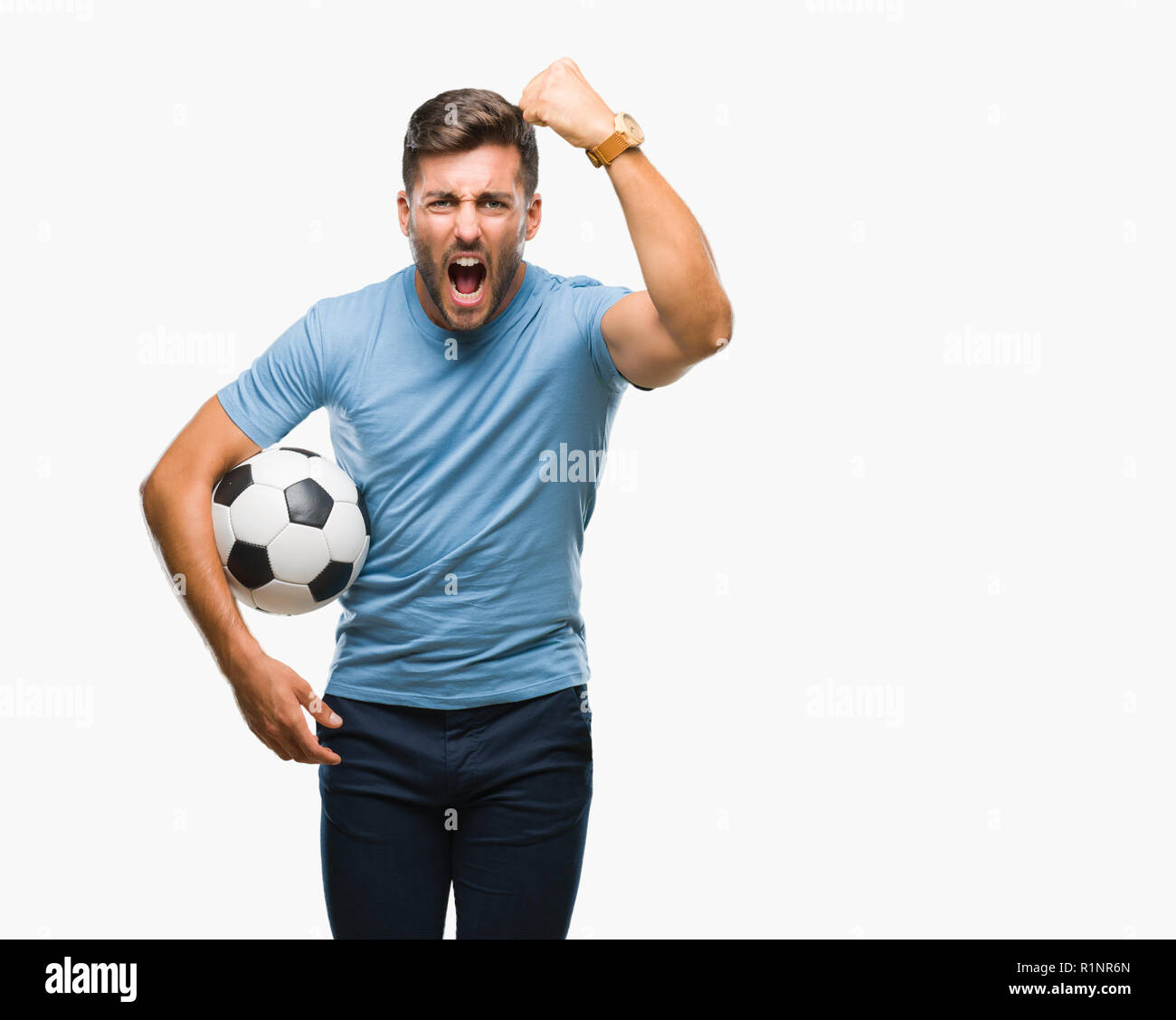 Young handsome man holding soccer football ball over isolated ...