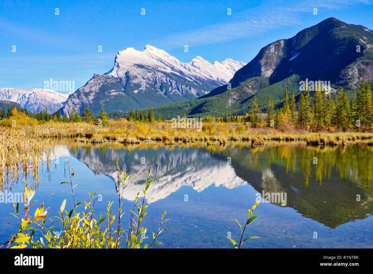 Mount Rundle reflected in calm waters of Vermillion Lakes, Banff ...