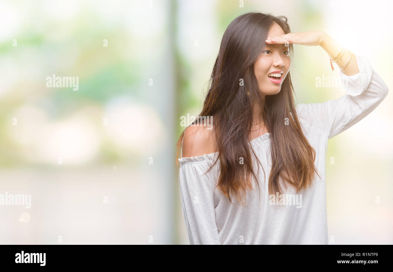Young asian woman over isolated background very happy and smiling ...