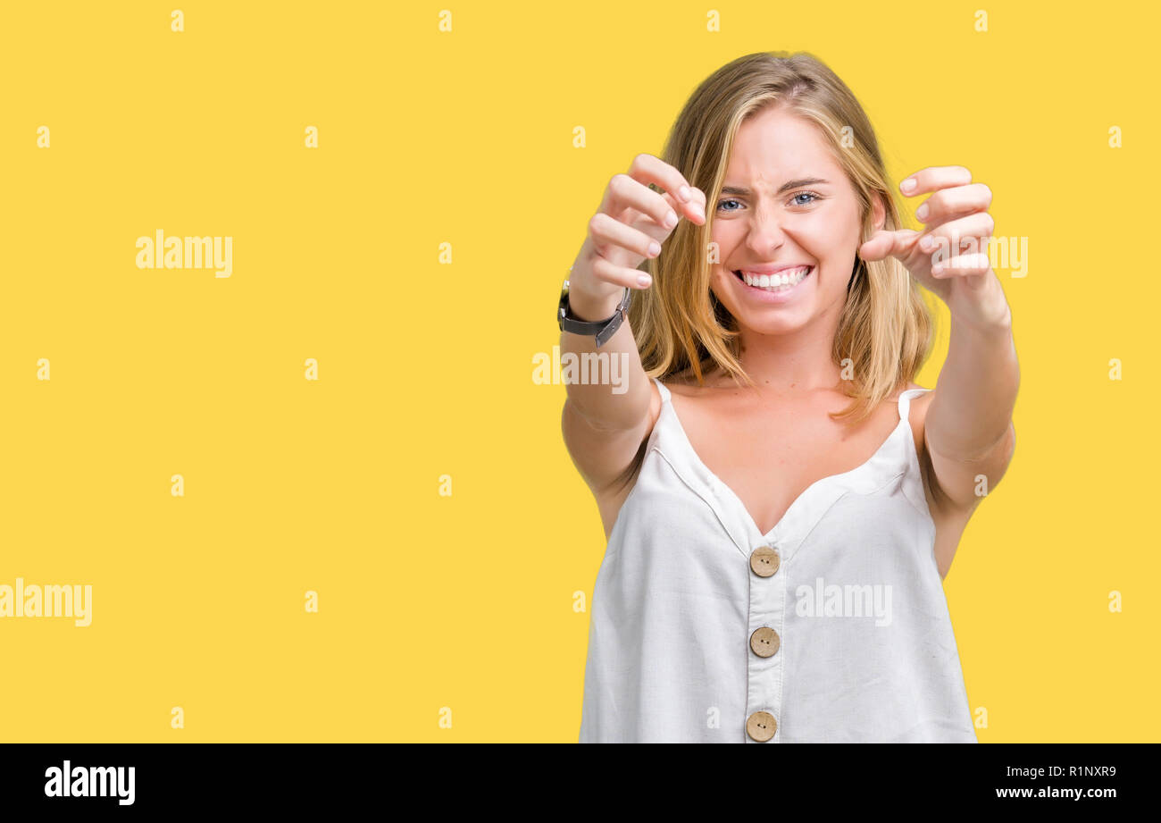 Beautiful young woman over isolated background Shouting frustrated with ...