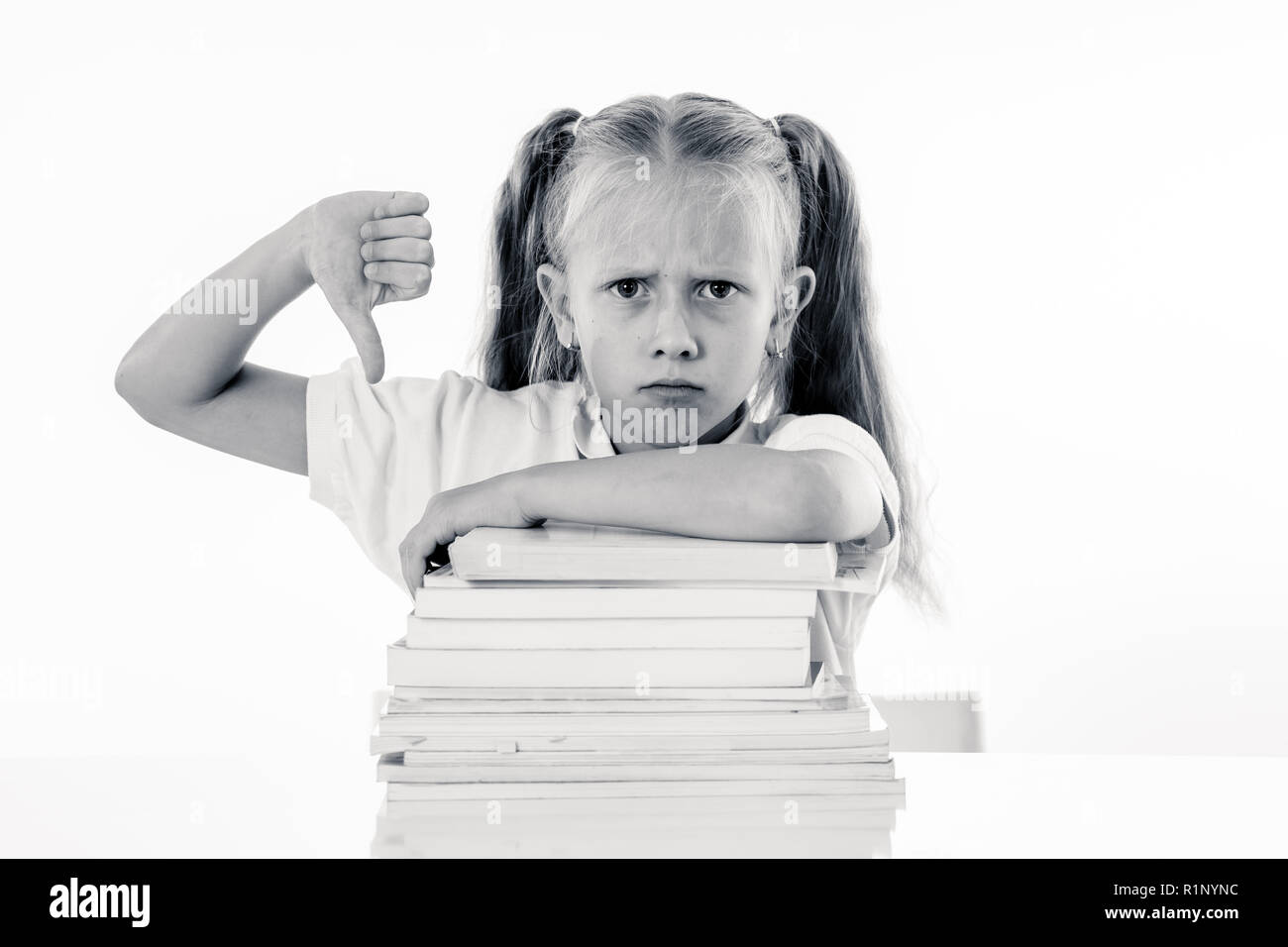 Overwhelmed little girl with a negative attitude towards studies and ...