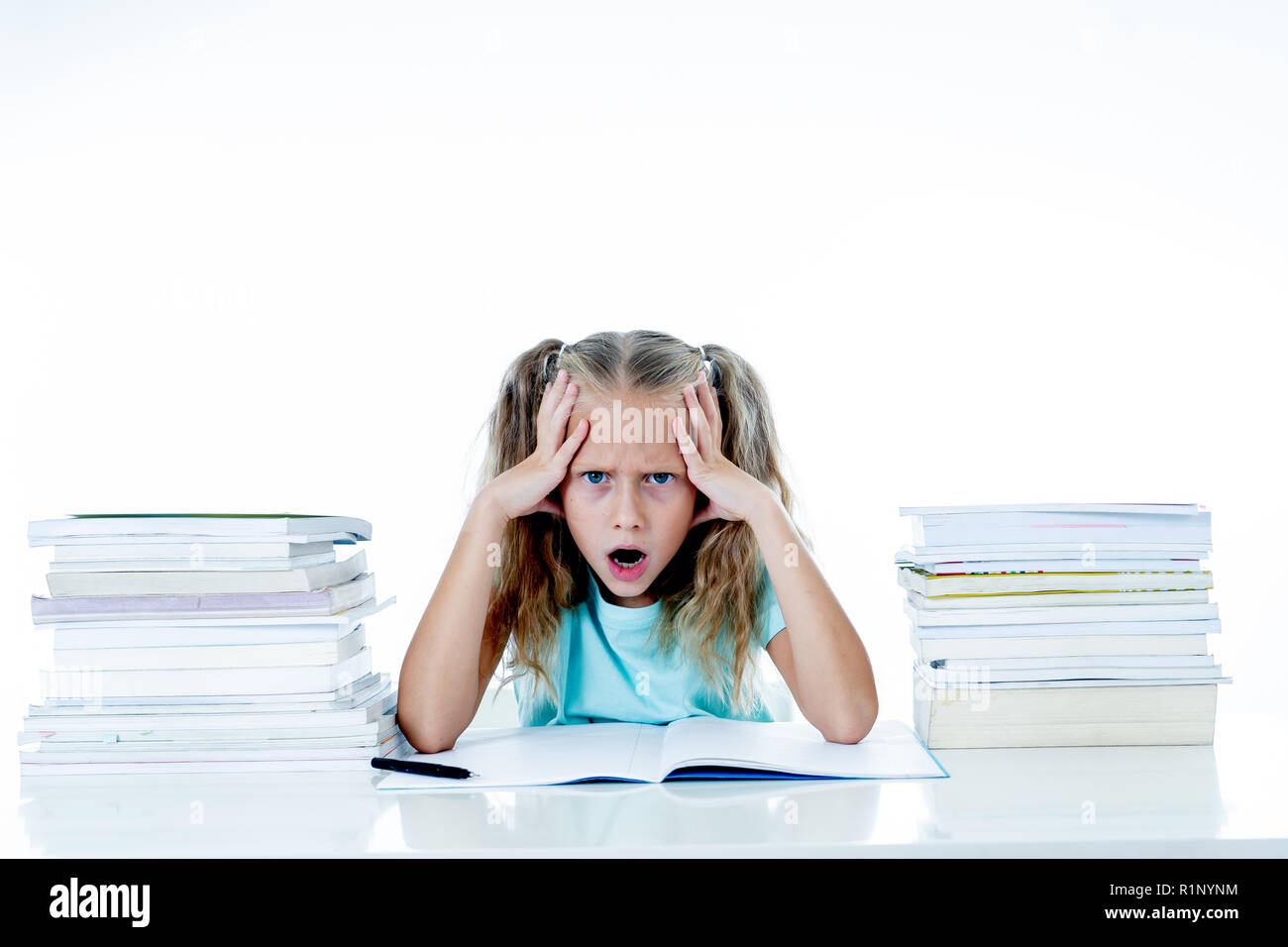 Frustrated little schoolgirl feeling a failure unable to concentrate in ...