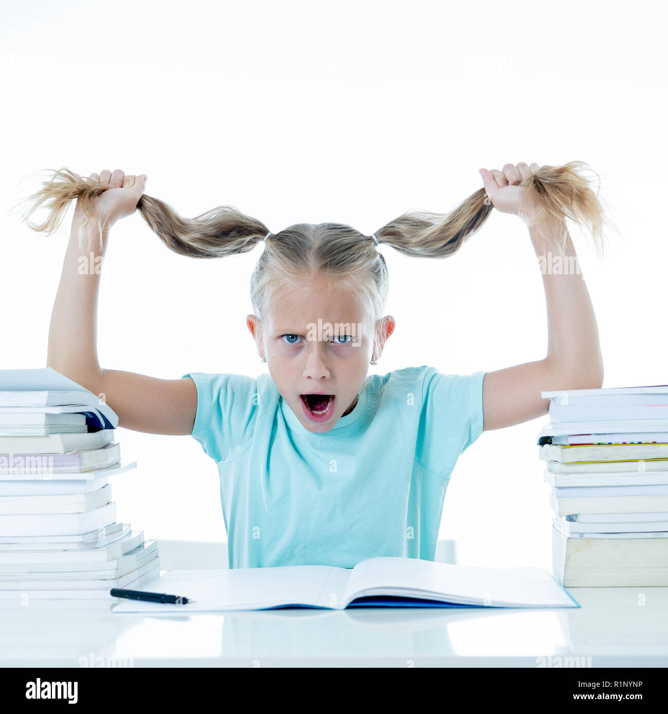 Beautiful school girl trying to study having too many homework that It ...