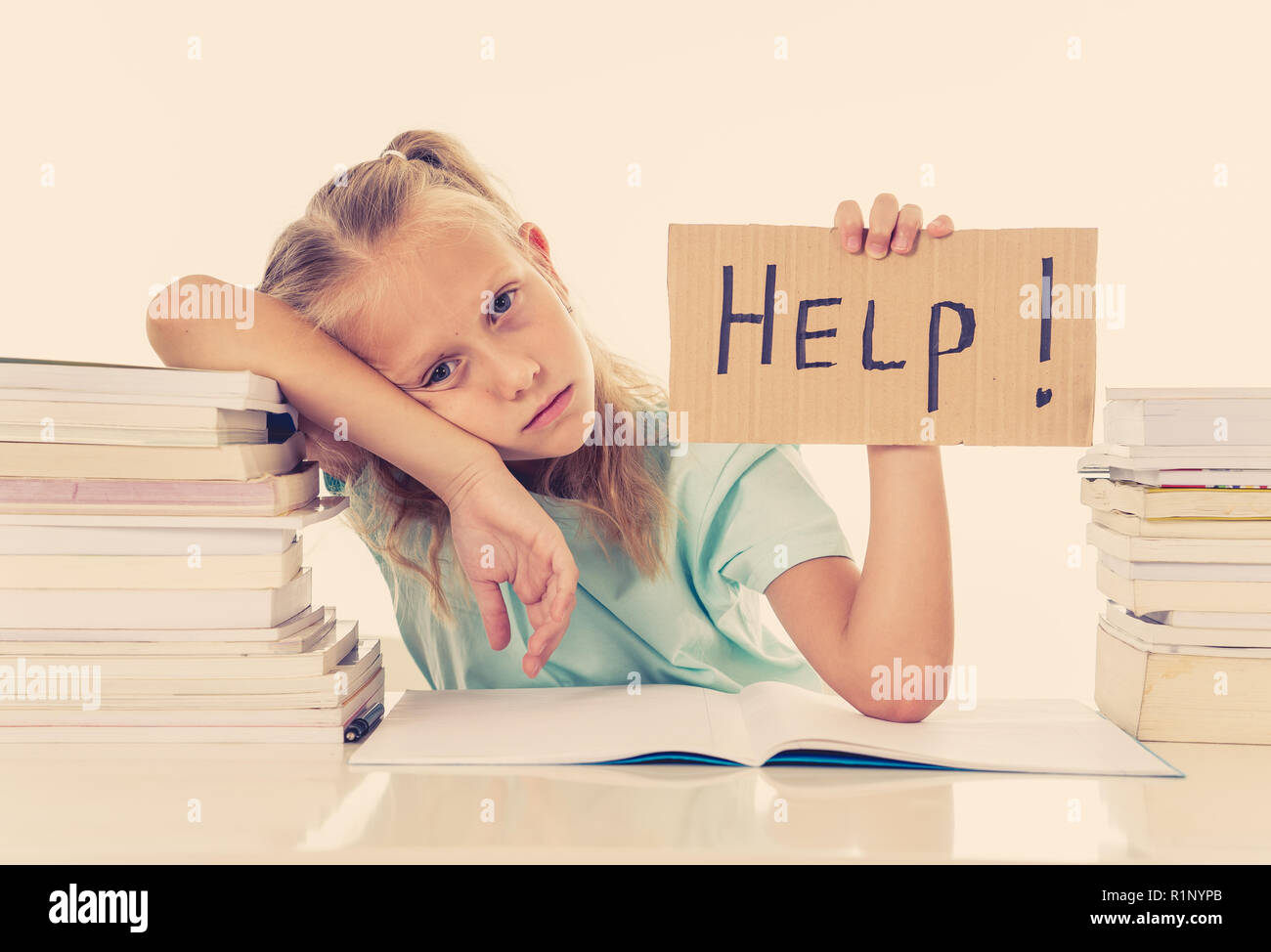 Frustrated little schoolgirl feeling a failure unable to concentrate in ...