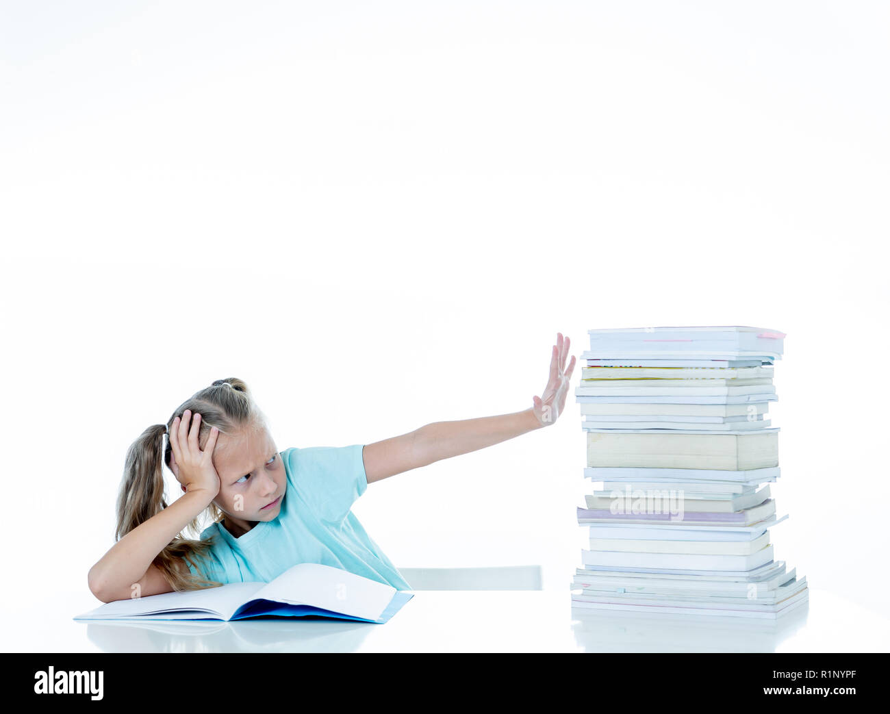 Beautiful school girl trying to study having too many homework that It ...