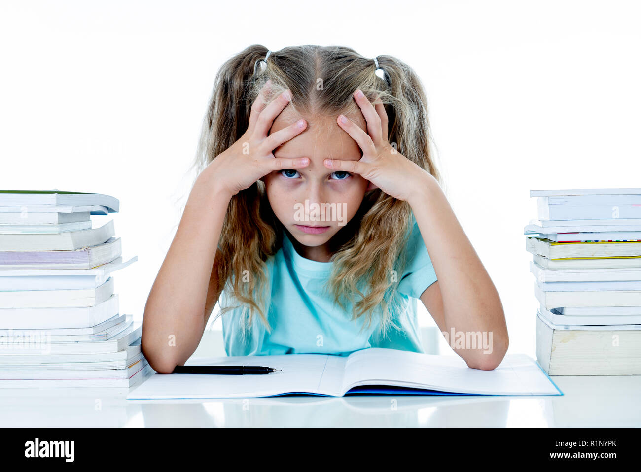 Beautiful school girl trying to study having too many homework that It ...
