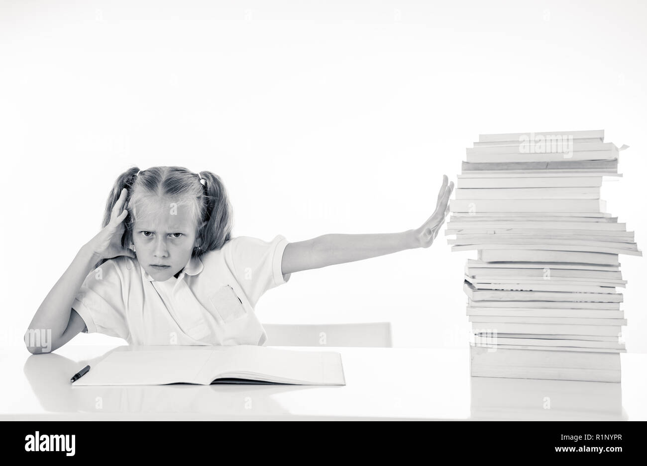 Overwhelmed little girl with a negative attitude towards studies and ...